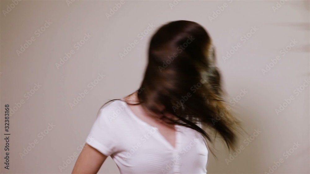 Smiling woman shaking her hair Stock Video | Adobe Stock