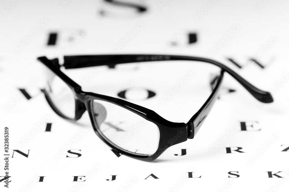 Optical reading glasses on the eyesight table Stock Photo | Adobe Stock
