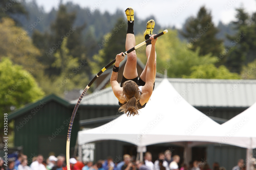 Female athlete competing in the pole vault Stock Photo | Adobe Stock