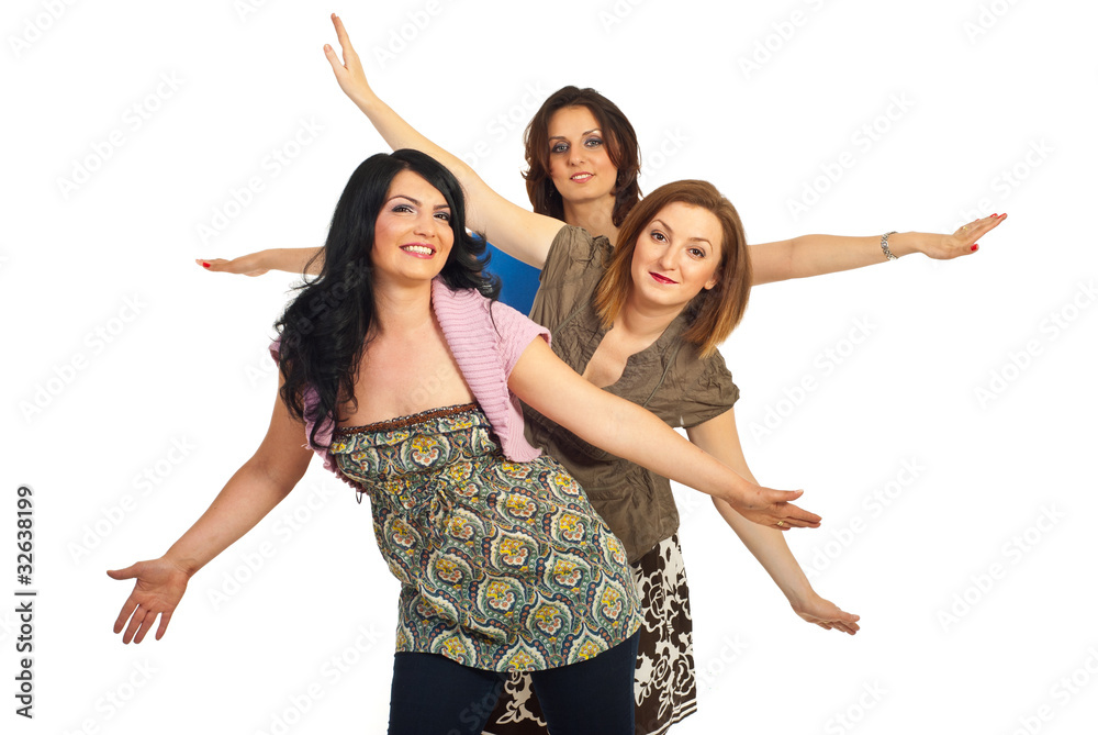 Smiling women with arms up Stock Photo | Adobe Stock