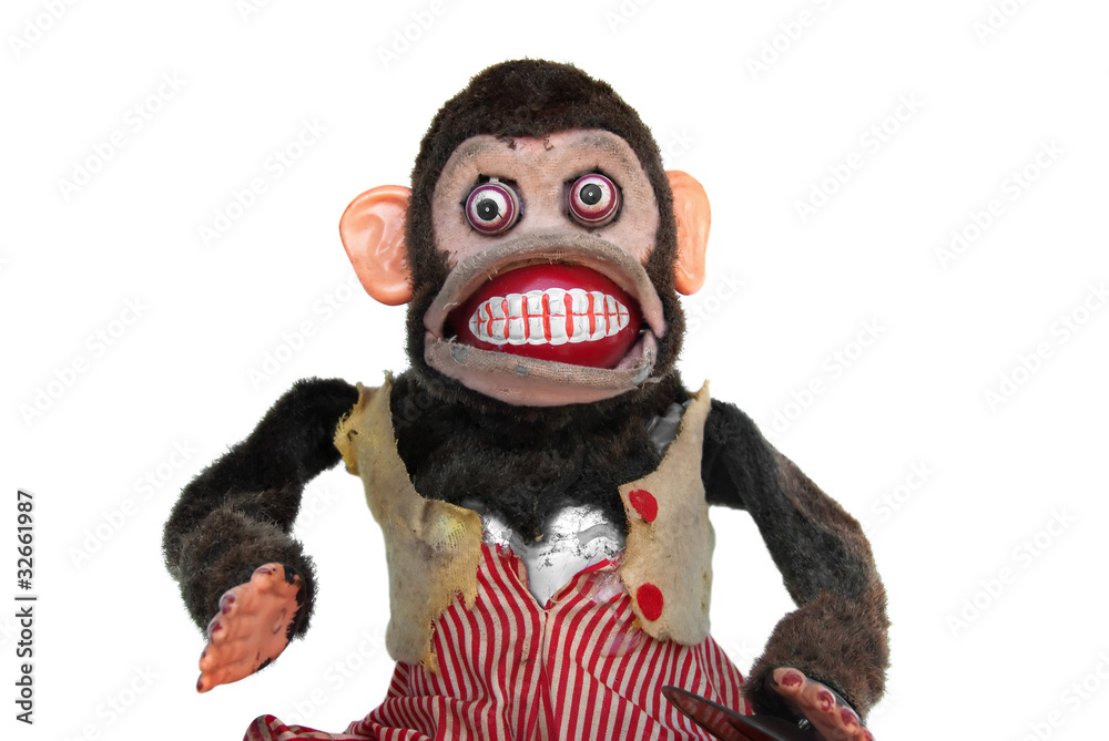 Damaged mechanical chimp with ripped vest, uneven eyes Stock Photo ...