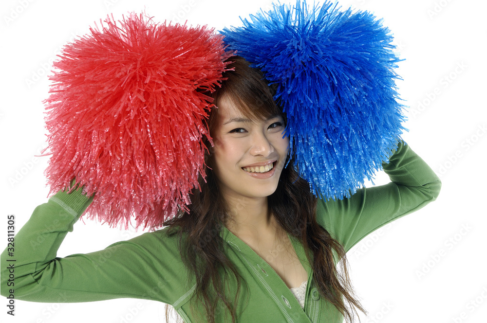Young cheerleader with red and blue pom-poms smiling Stock Photo ...