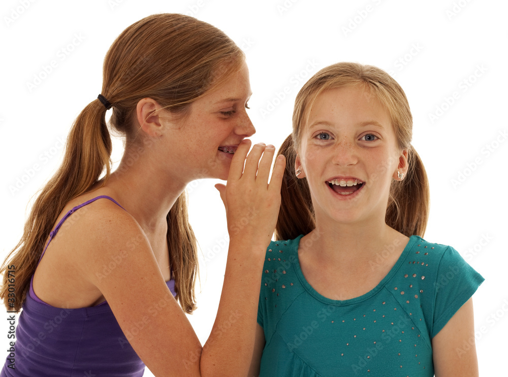 happy tween girls telling secrets Stock Photo | Adobe Stock