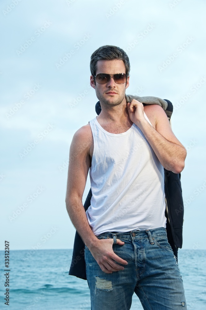 Handsome man on the beach Stock Photo | Adobe Stock