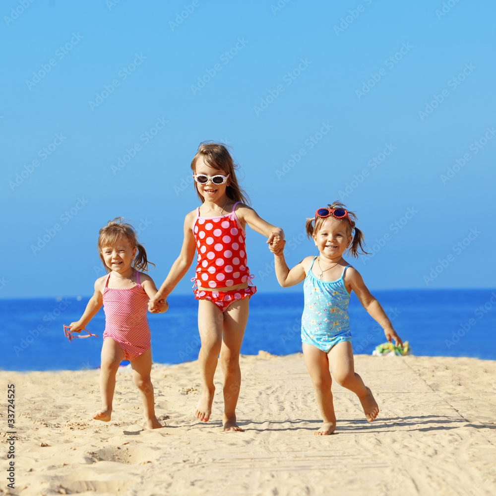 Kids playing at the beach Stock Photo | Adobe Stock