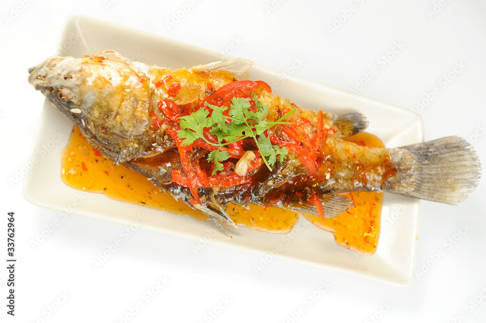 fried grouper fish with sauce Stock Photo | Adobe Stock
