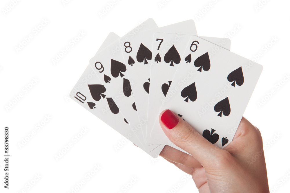 Straight Flush of spades in hand Stock Photo | Adobe Stock