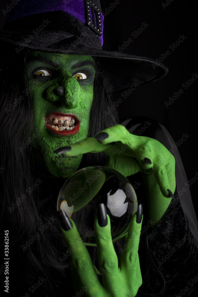 Evil witch and her crystal ball, black background. Stock Photo | Adobe ...