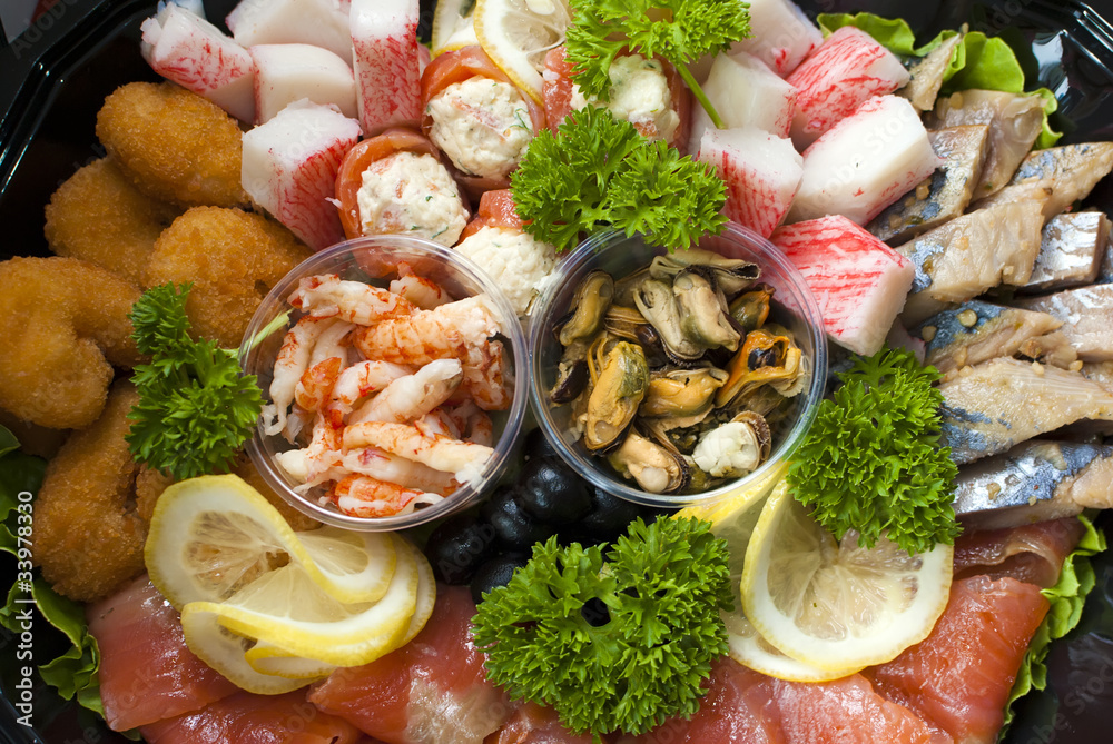 Cocktail of marine food: shrimp, mussels, herring, surimi, trout Stock ...