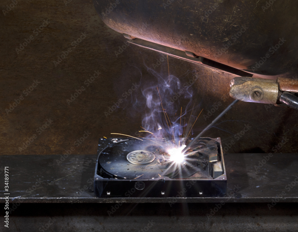 repairing a defect hard disk with welding apparatus Stock Photo | Adobe ...