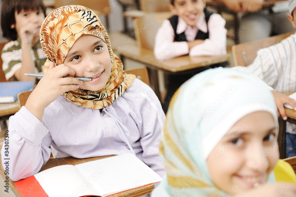 Muslim girl student in classroom thinking Stock Photo | Adobe Stock