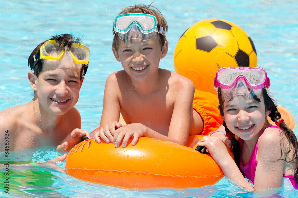 Children in swimming pool Stock Photo | Adobe Stock