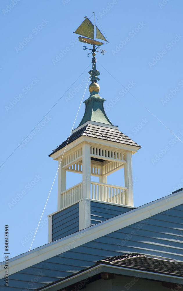 Wind vane in the form of a sailing ship on a roof cupola Stock Photo ...