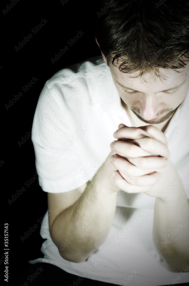 Man praying Stock Photo | Adobe Stock