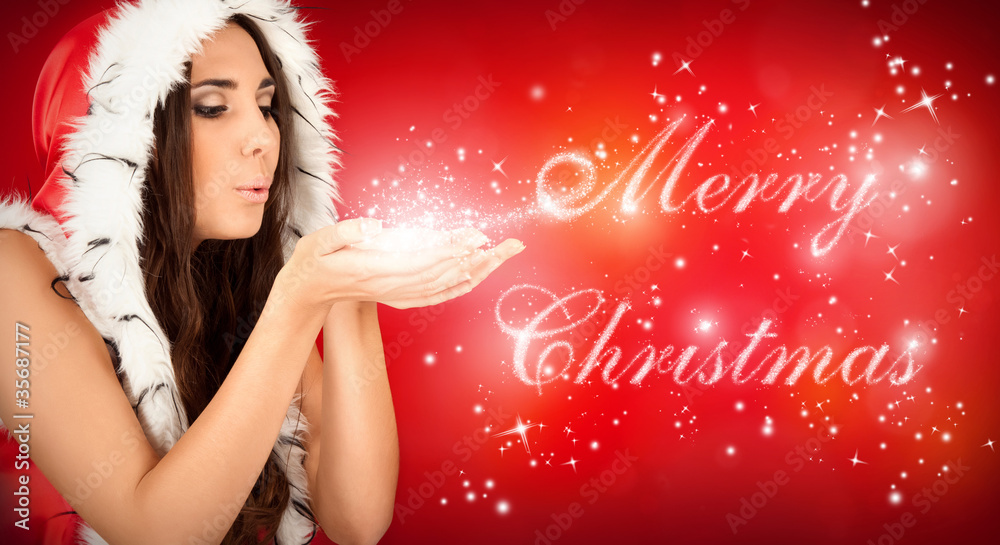 sexy santa girl blowing magical "Merry Chrsimas" text Stock Photo ...