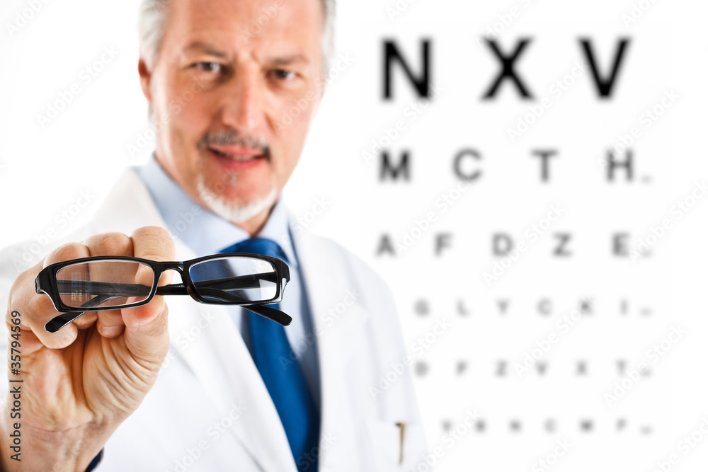 Oculist giving you a pair of eyeglasses Stock Photo | Adobe Stock