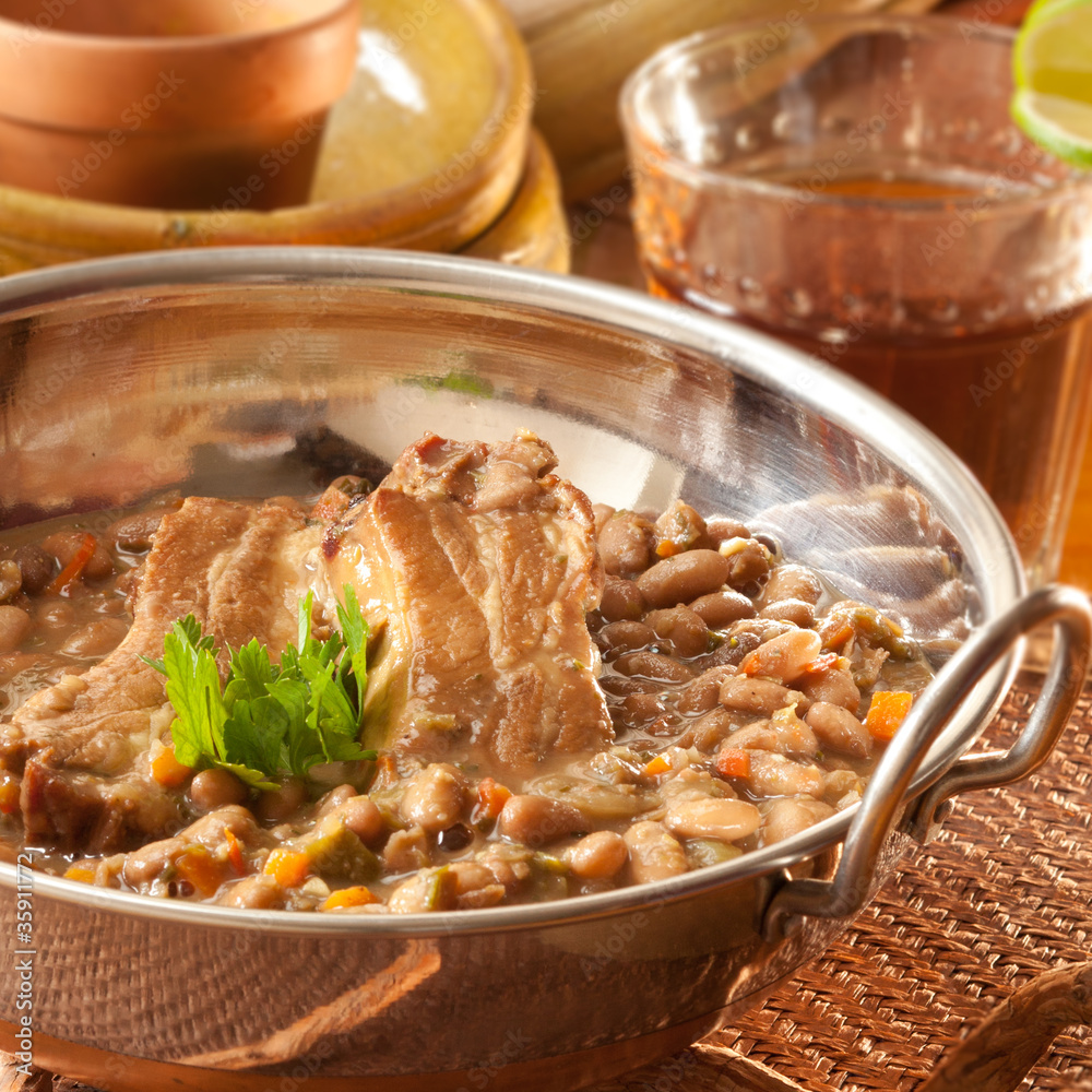 Guiso de porotos con cerdo ahumado Stock Photo | Adobe Stock