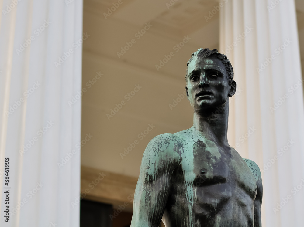 bronze statue of a athletic male body in front of a greek temple Stock ...