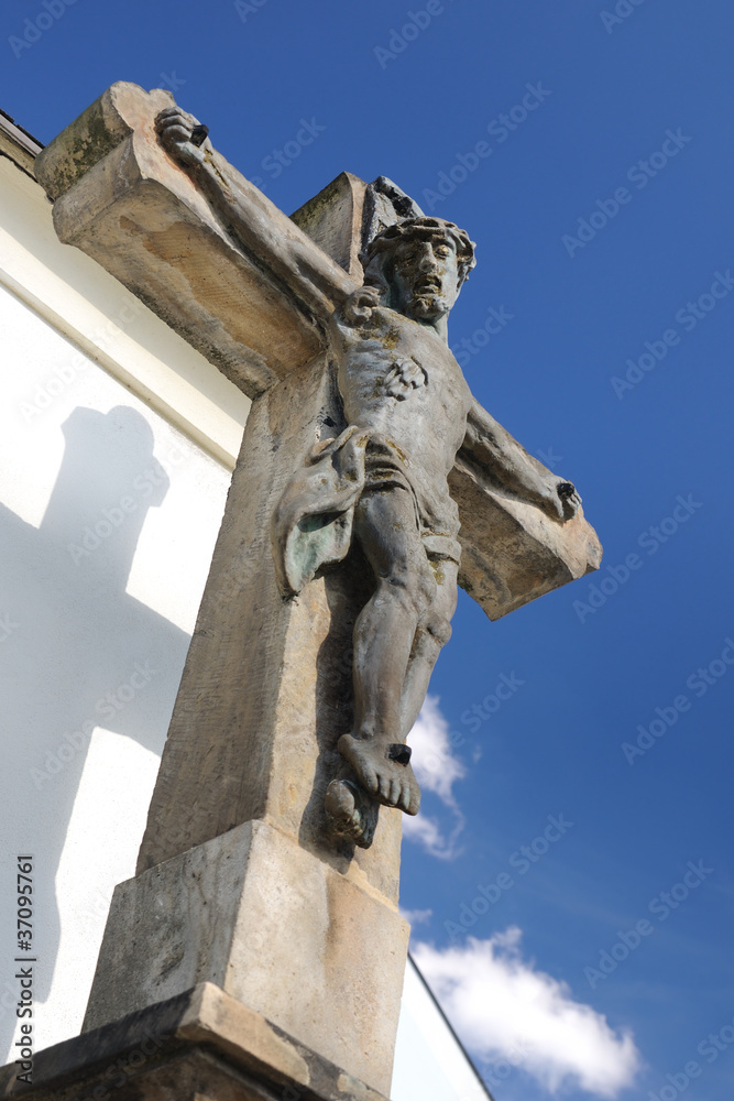 Jesus Christ on the cross - carved stone Stock Photo | Adobe Stock