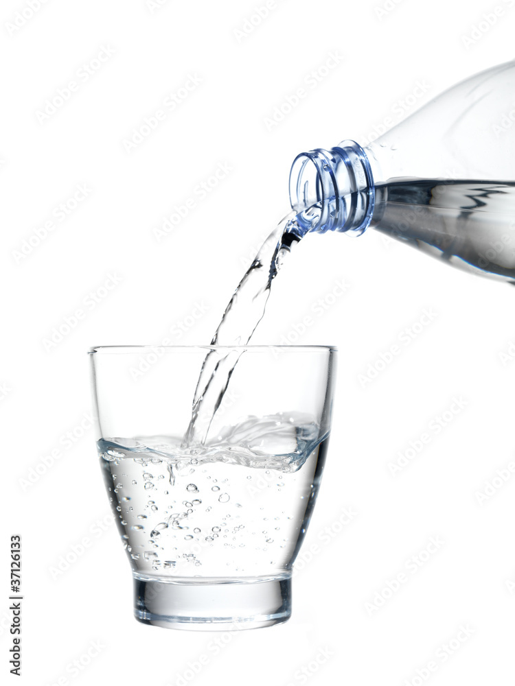 pouring mineral water in a water glass Stock Photo | Adobe Stock