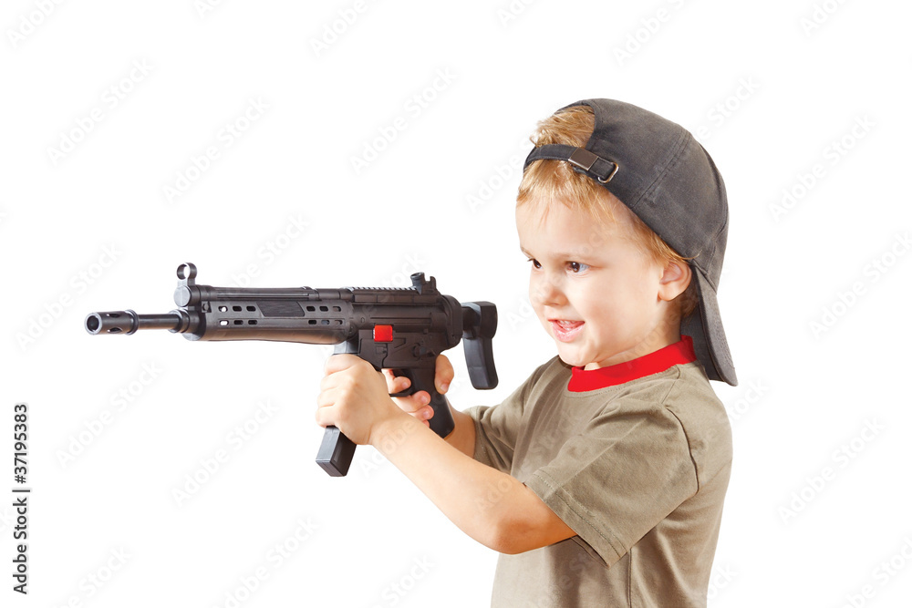 Little boy plays with gun on a white background Stock Photo | Adobe Stock