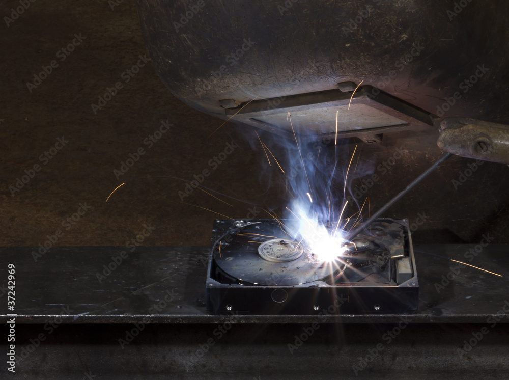 electrical welding on open hard disk drive Stock Photo | Adobe Stock