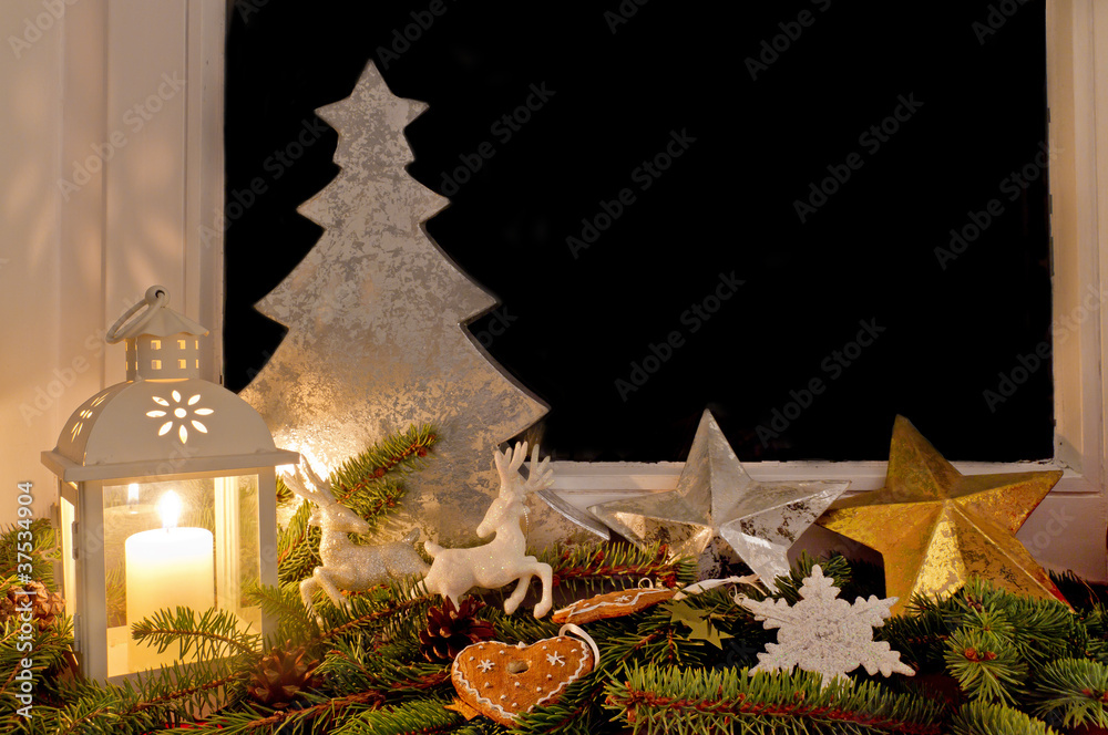 Christmas decorations on a window sill Stock Photo | Adobe Stock
