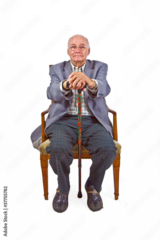 old man sitting in the armchair with his walking stick Stock Photo ...
