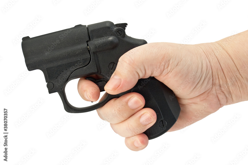 Traumatic pistol in his hand Stock Photo | Adobe Stock