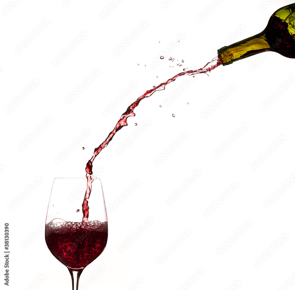 Wine pouring from bottle into glass Stock Photo | Adobe Stock