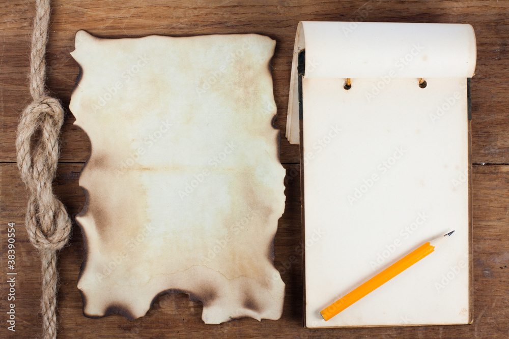 Burnt Paper On Wood Background