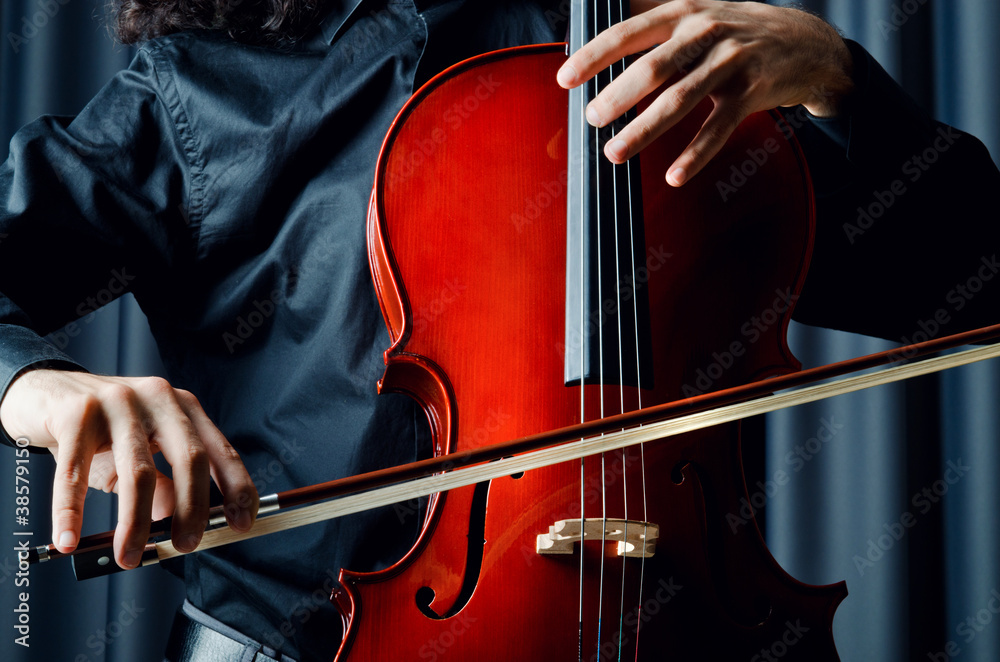 Cello player during performance Stock Photo | Adobe Stock