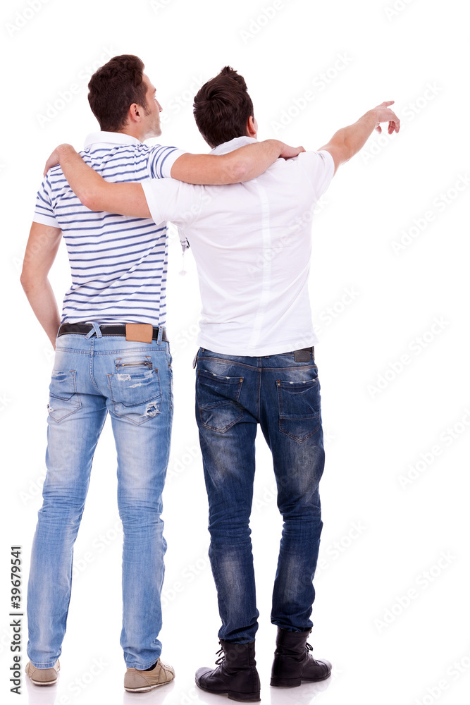 two young men pointing at somethin Stock Photo | Adobe Stock