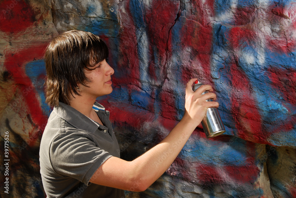 Poster Teenager spray painting a rock – Wall Art | UkPosters