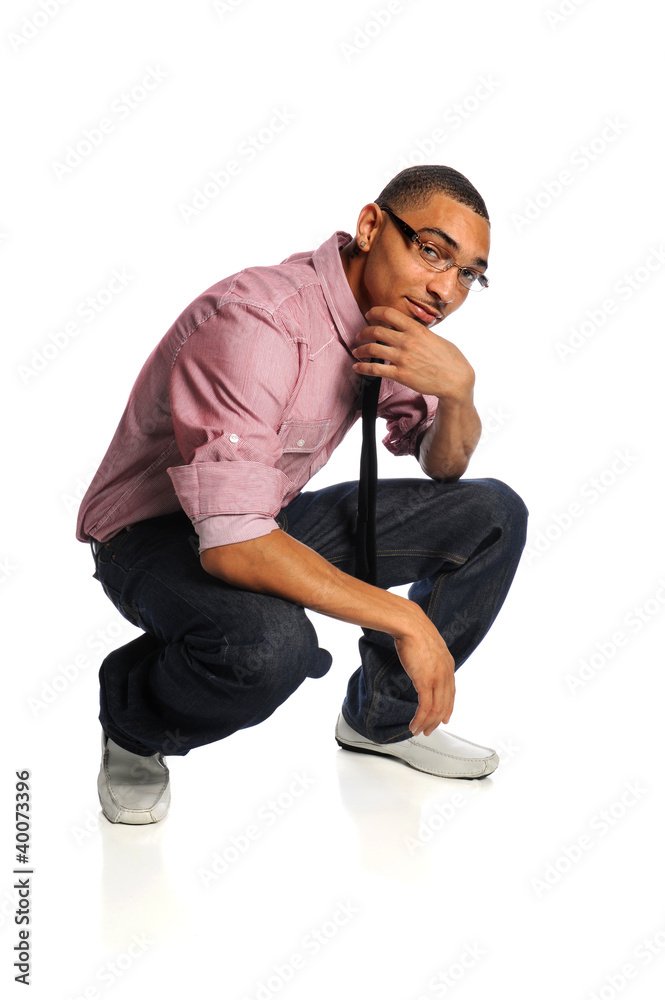 Young Man Crouching Stock Photo | Adobe Stock