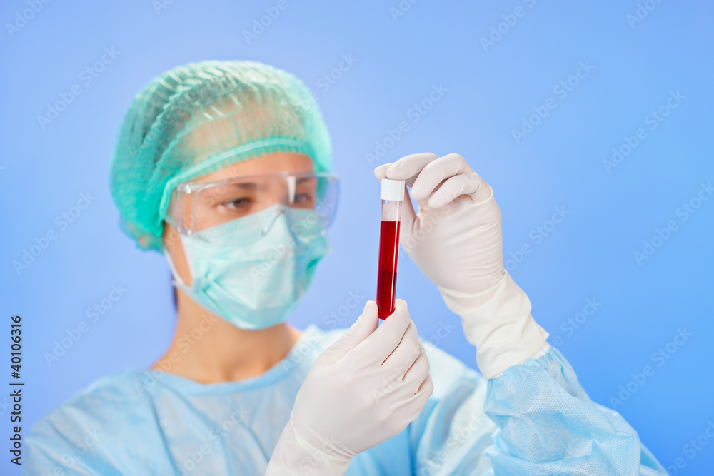 Medical test tube samples in doctor's hand on blue background Stock ...