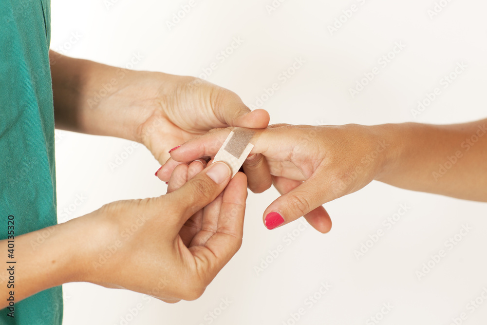 Pflaster aufkleben Stock-Foto | Adobe Stock