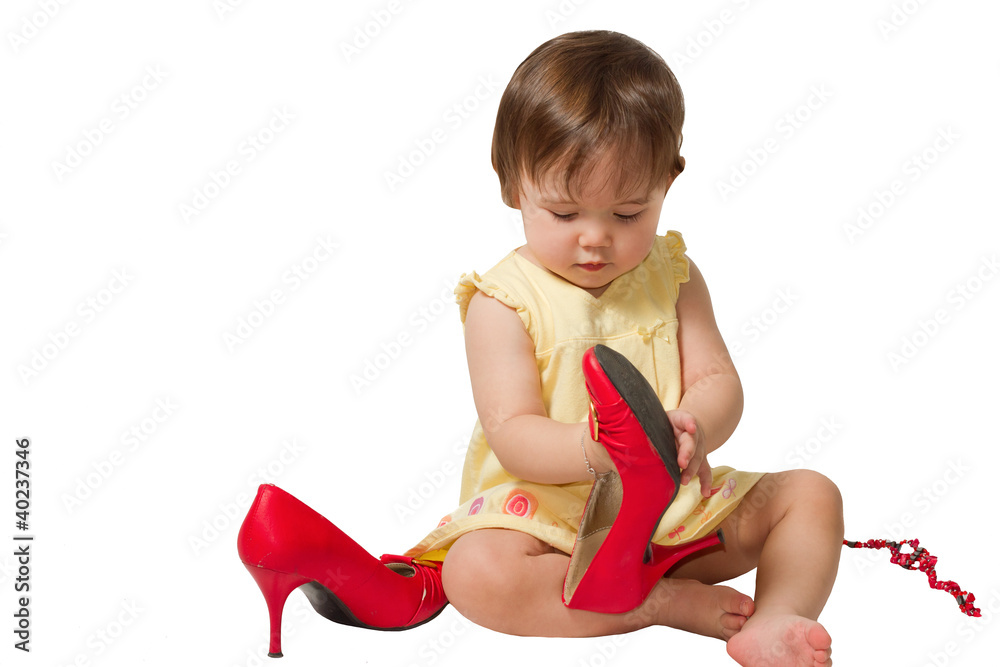 little girl-child trying on mother's big red shoes Stock Photo | Adobe ...