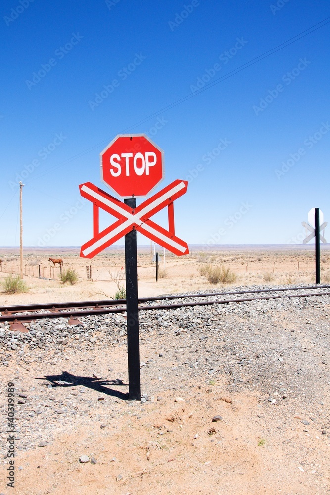 Warning of road sign - stop and railway cross the road, Namibia Stock ...