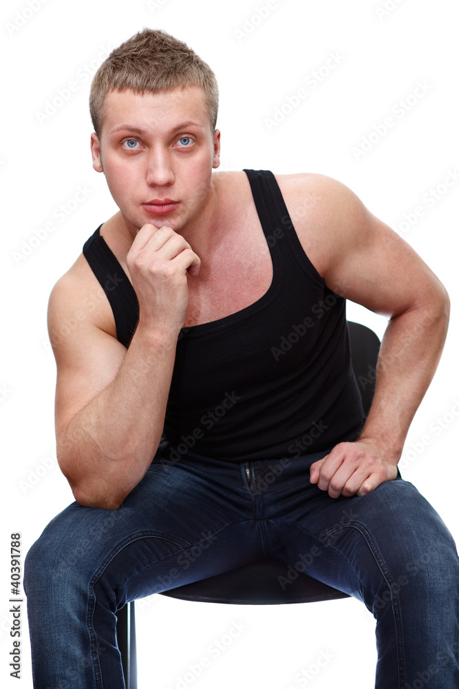 Muscle man in black t-shirt sitting on chair isolated on white Stock ...