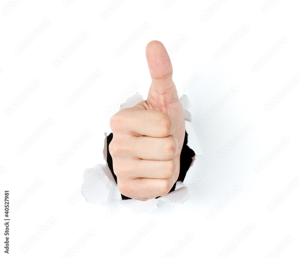 Thumbs up through the paper hole isolated on white background Stock ...