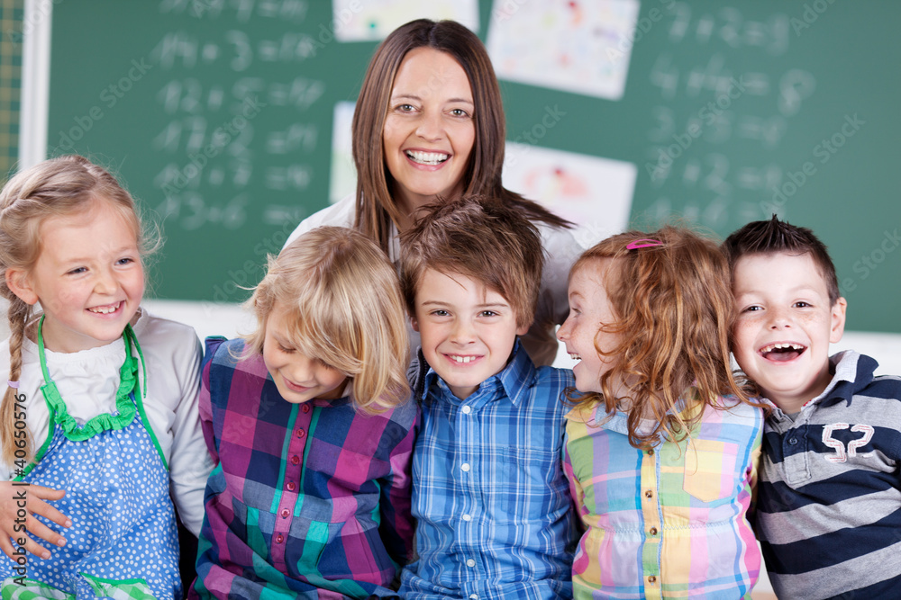 lachende schulkinder mit ihrer lehrerin Stock Photo | Adobe Stock