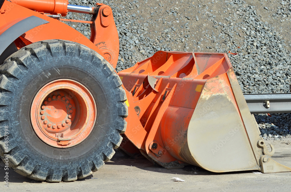 Orange bulldozer on bridge road construction site Stock Photo | Adobe Stock
