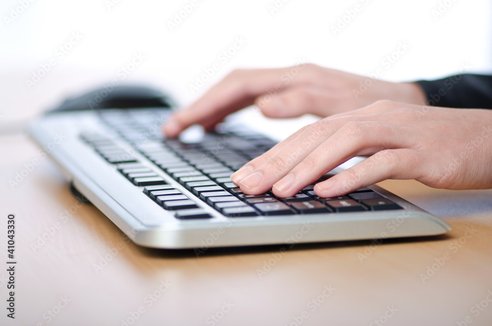 Hands typing on the keyboard Stock Photo | Adobe Stock