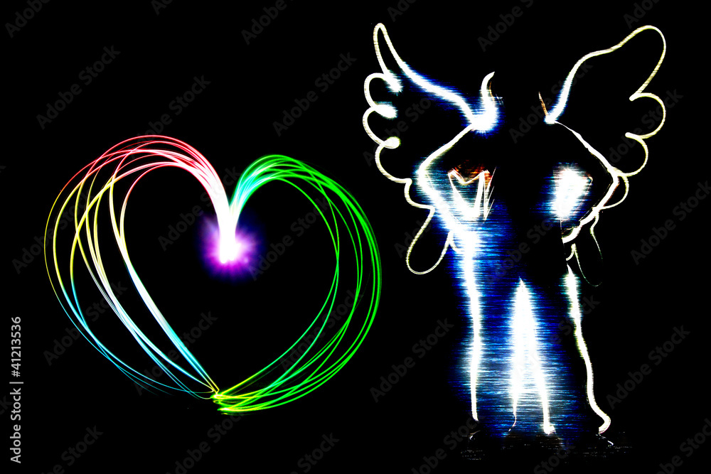 angel and heart shape drawing by flashlight multiple color in th Stock ...