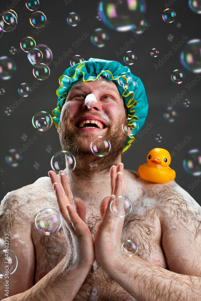 Happy man and soap bubbles Stock Photo | Adobe Stock