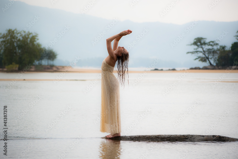 beautiful young girl in white dress standing in water Stock Photo ...