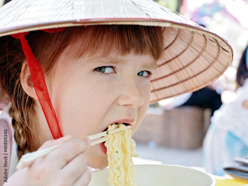 Little girl eating korean style spaghetti (ramen) Stock Photo | Adobe Stock