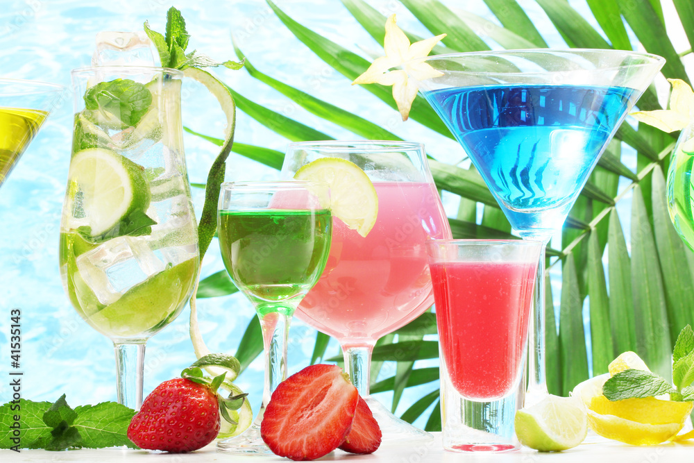 Glasses cocktails on table on blue sea background Stock Photo | Adobe Stock