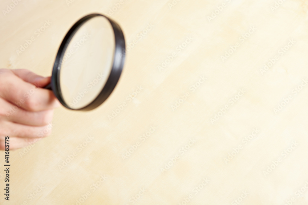 Hand hält Lupe Stock Photo | Adobe Stock